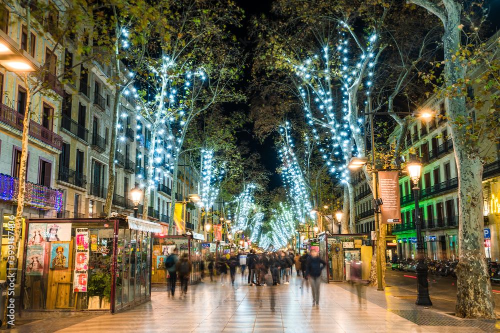 Night view of La Rambla street during Christmas season. La Rambla is a ...