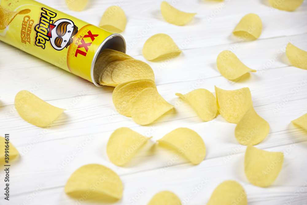 Pringles cheesy cheese flavour. Cardboard tube can with Pringles potato ...