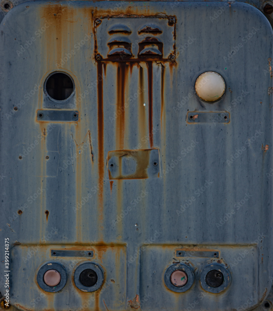 On rough wall, floor, paint peels off. Corrosion and rust of metal ...