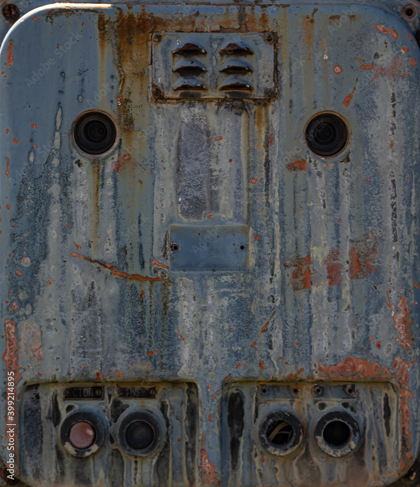 On rough wall, floor, paint peels off. Corrosion and rust of metal ...