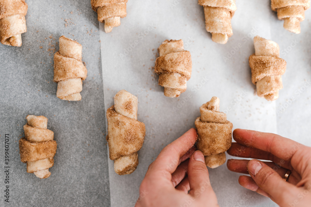 female hands take sweet croissants placed on paper Stock Photo | Adobe ...