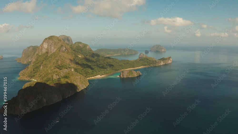 Cove with tropical rocky islands covered with rainforest, sea with blue ...