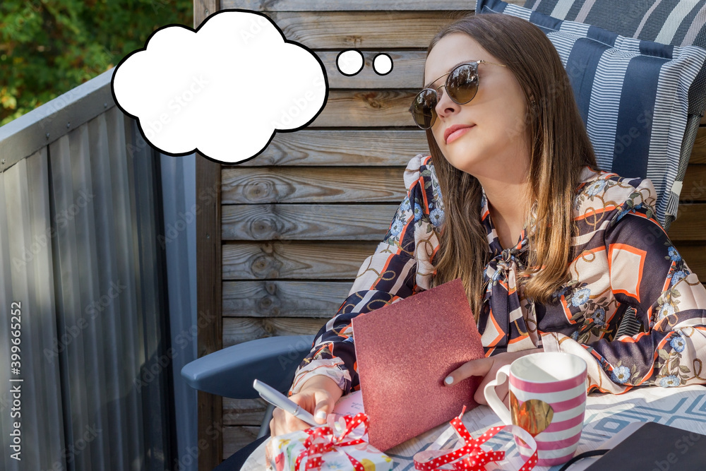 Beautiful young caucasian woman thinking about something while writing ...