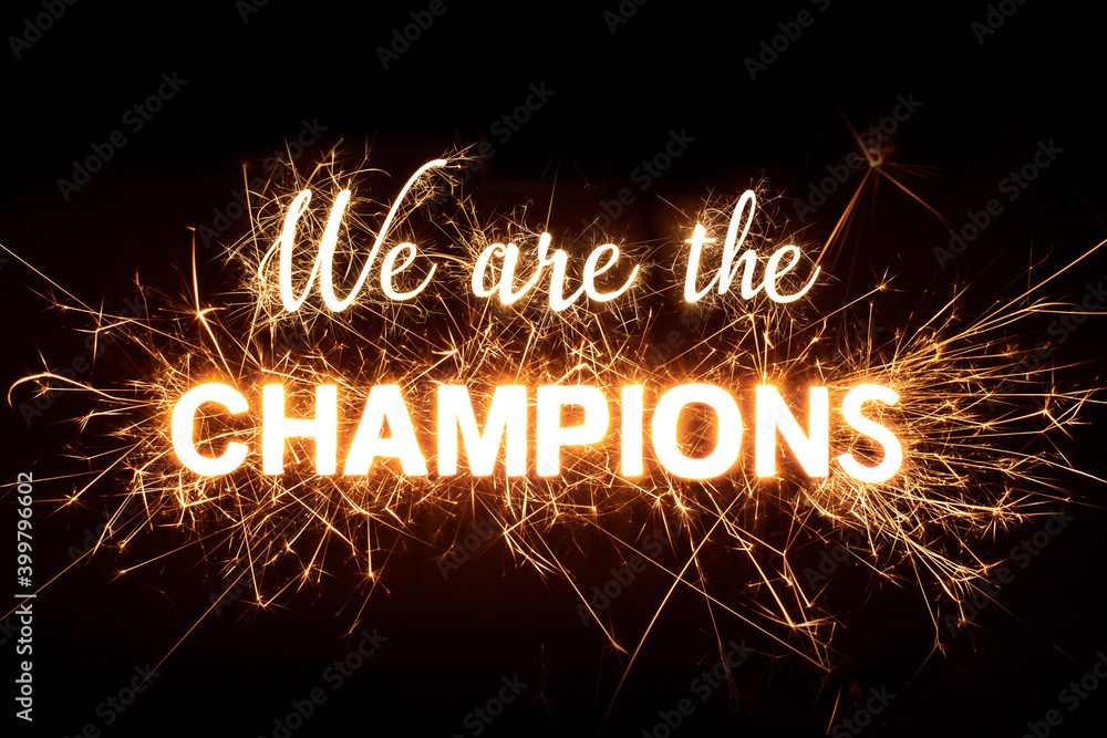 'We Are The Champions' in dazzling sparkler effect on dark background Stock Photo | Adobe Stock