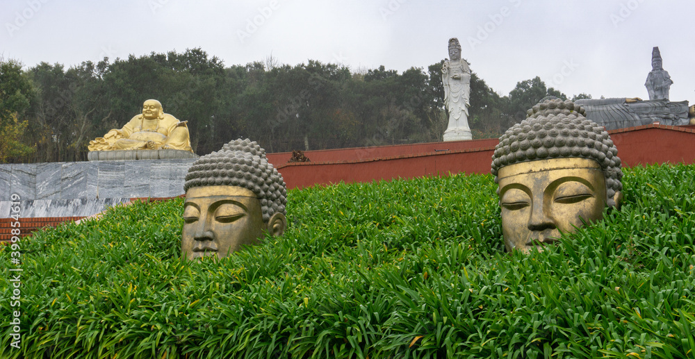 buddha statues in the famous Bacalhoa Buddha Eden Garden in central ...