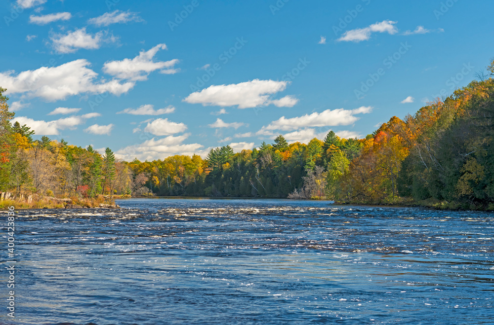 North Woods River Flowing into the Fall Colors Stock Photo | Adobe Stock