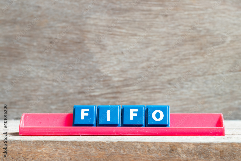 Tile letter on red rack in word FIFO (Abbreviation of first in first ...