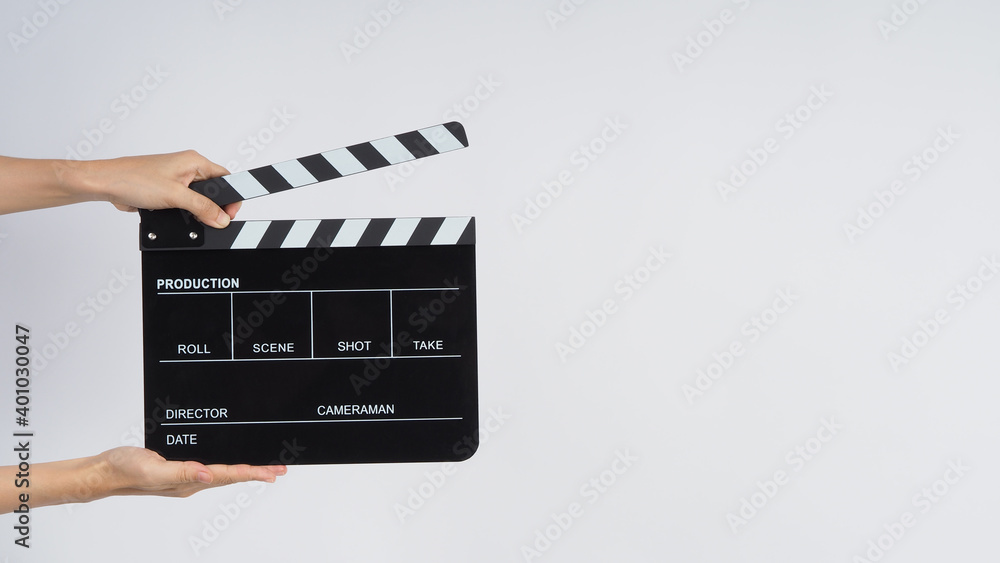 Hands is holding black Clapper board or Clapperboard or movie slate. it ...