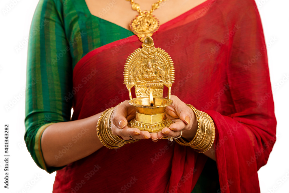 Hindu Indian young women holding Deepam in hands studio shot ...