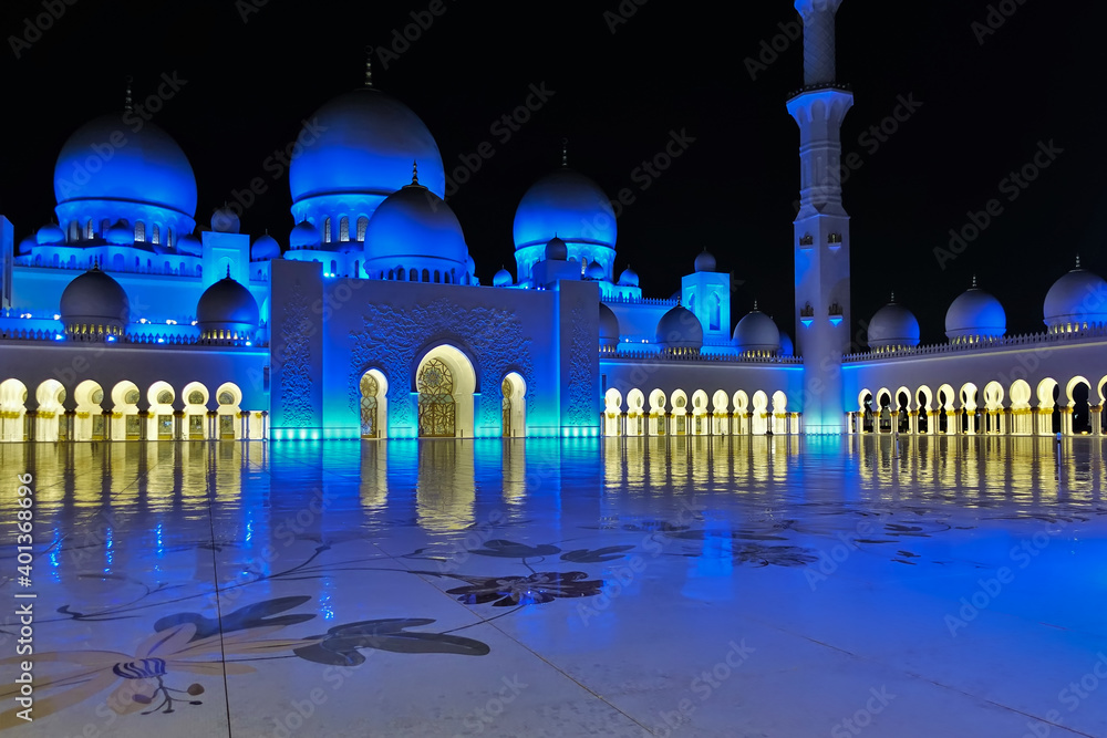 Arab mosque in the evening. Blue domes and minarets against the black ...