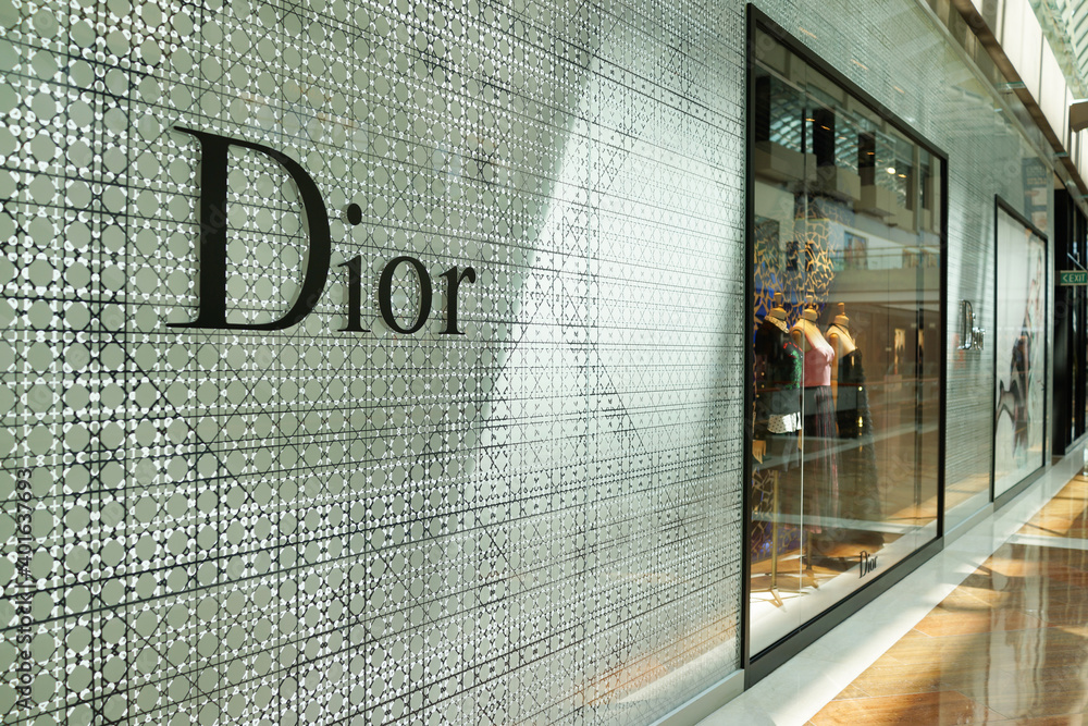 Dior fashion storefront at Marina Bay Sands, The company designs and ...