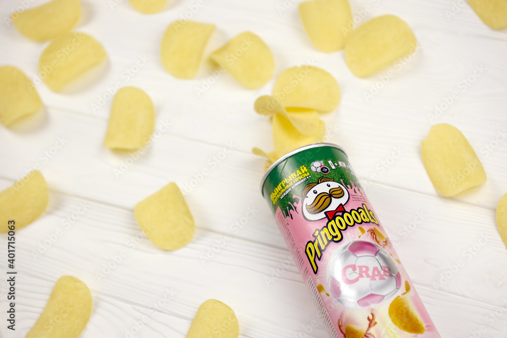 Pringles crab flavour. Cardboard tube can with Pringles potato chips on ...