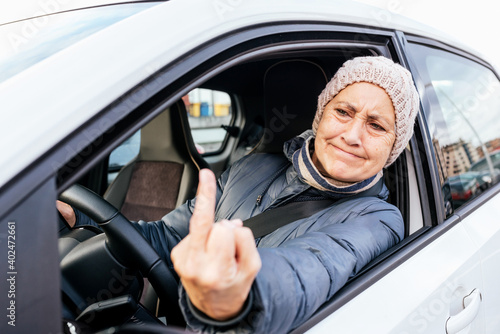 angry old lady driving a car and Showing middle finger doing bad ...