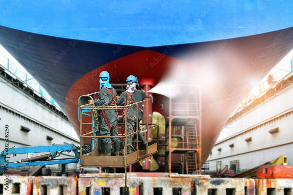 Container big ship at stern view Worker in floating dry dock with water ...