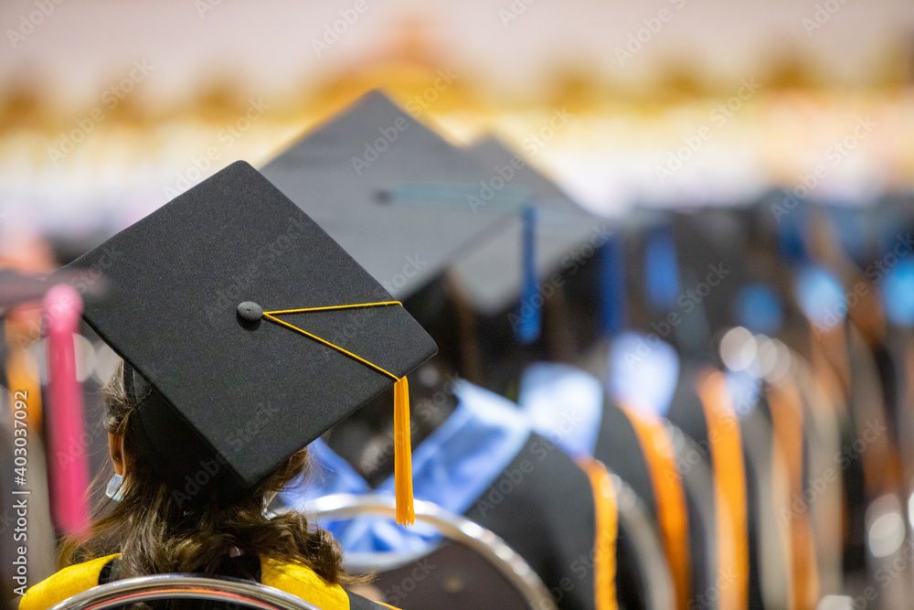 Graduation cap image from the back of graduates Graduates attending the ...