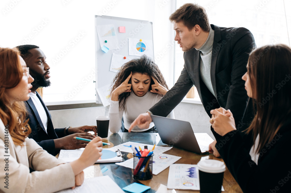 Corporate business negotiations. Frustrated group of multiracial people ...