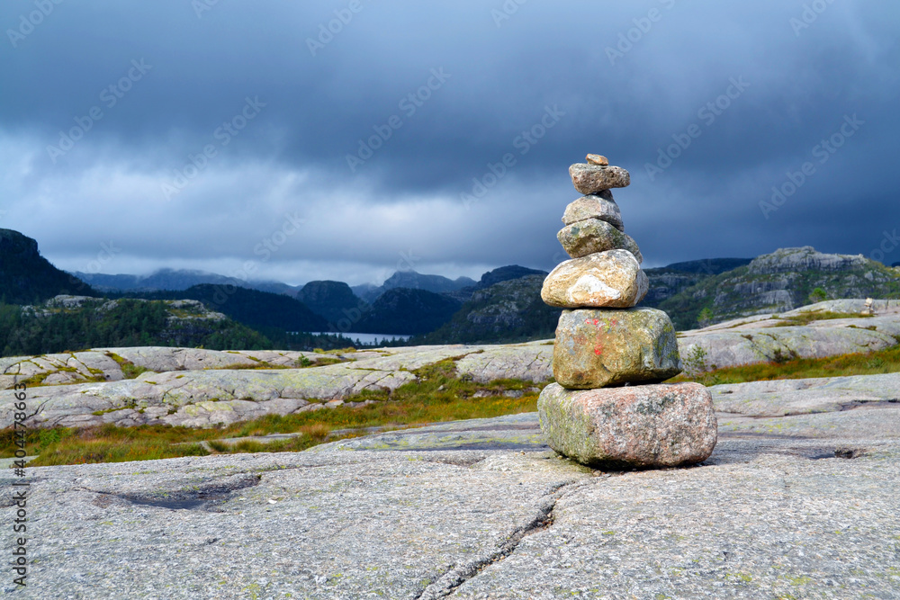 Mountain landscape with the stone pyramid on the foreground. Scenery ...