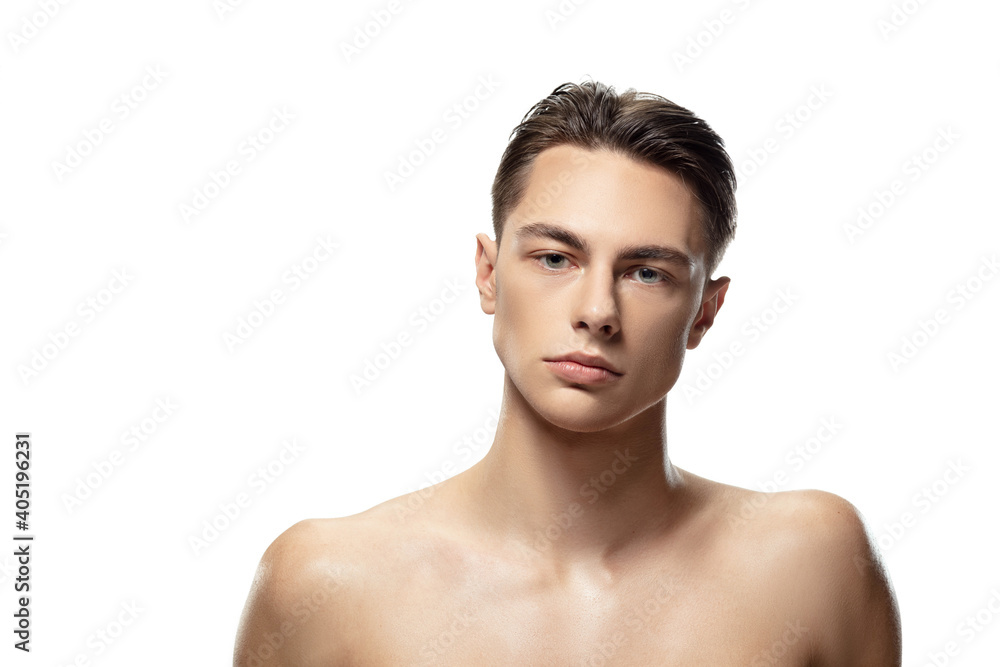 Serious. Portrait of young man isolated on white studio background ...