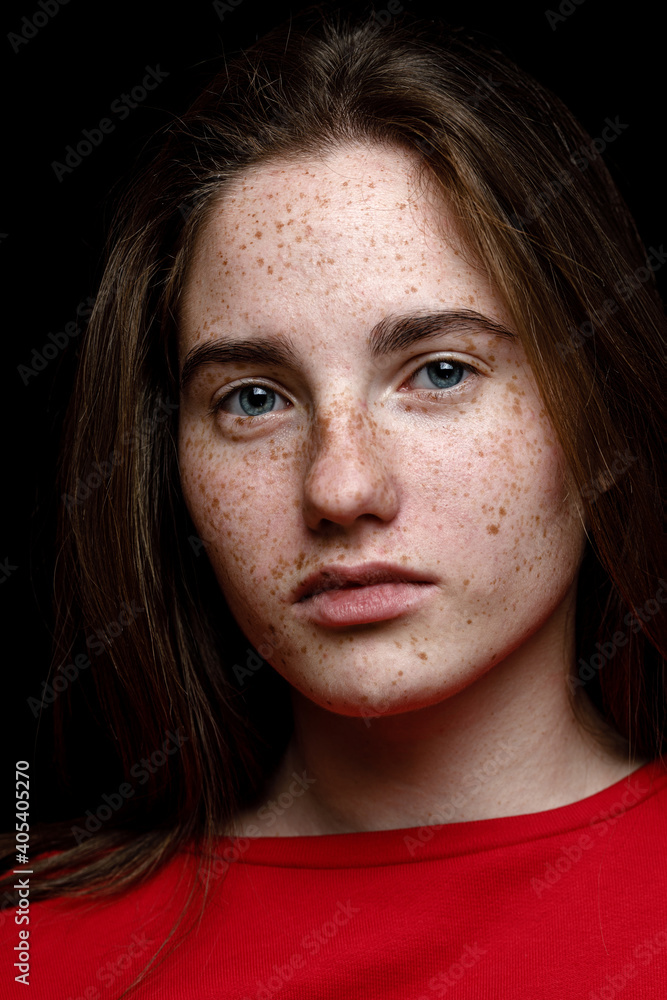 Freckled face. Freckles Woman portrait. Close up Beautiful blue eyed ...