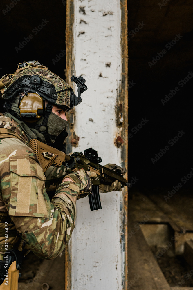 Special forces soldier doing tactical training in building clearing ...