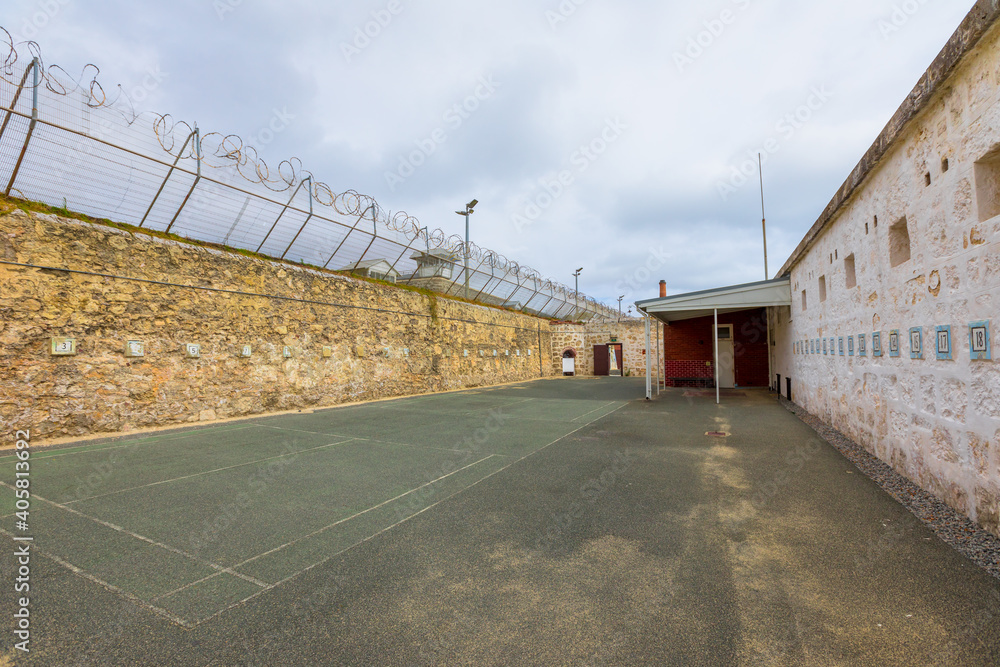 courtyard with barbed wire of Fremantle Prison historic building ...
