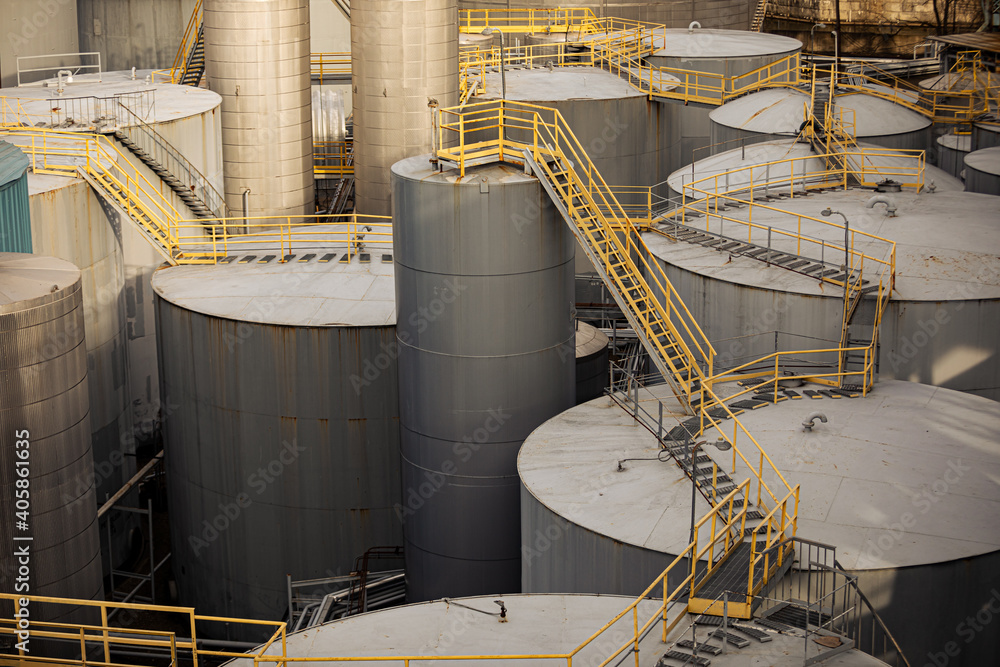 Oil and natural gas refinery and storage tanks area with relevance to ...