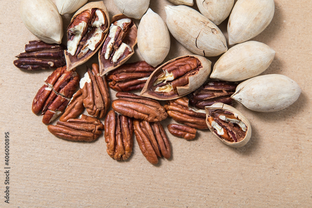 Peeled pecans, in the shell and without. Carya illinoinensis nuts laid ...