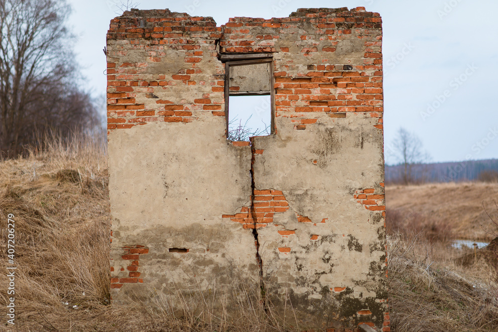 old destroyed building without roof and window made of red brick and ...