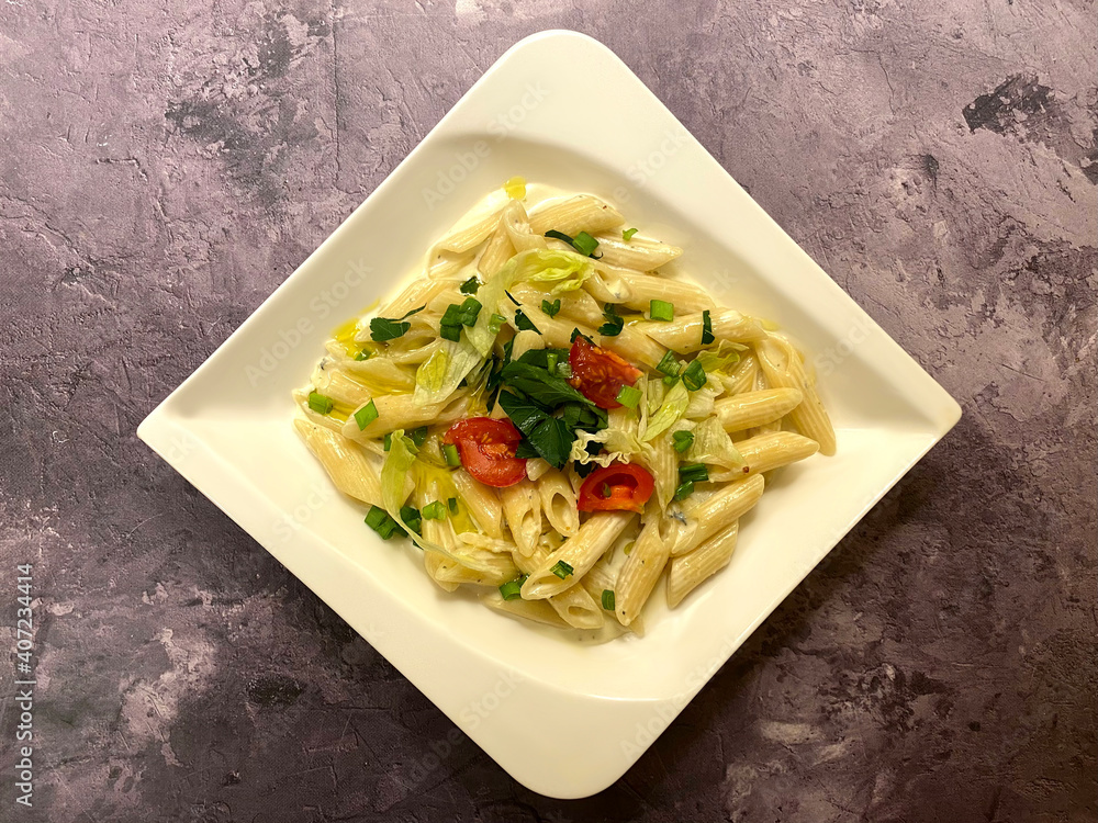 Penne rigate pasta with four types of cheese, also known as " pasta ai ...