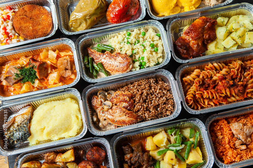 Business lunch in eco plastic container ready for delivery.Top view ...