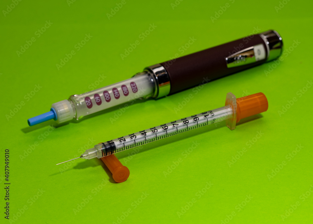 Insulin syringe and grey insulin injector for diabetes isolated on ...