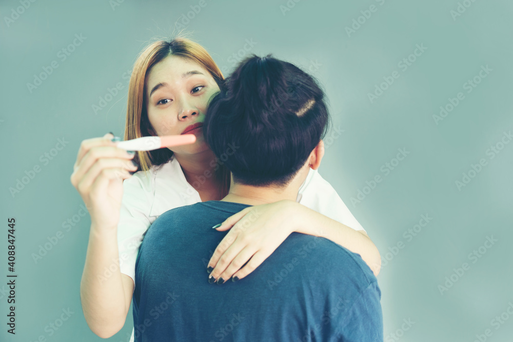 Jolly female is holding positive pregnancy test and rejoicing with ...