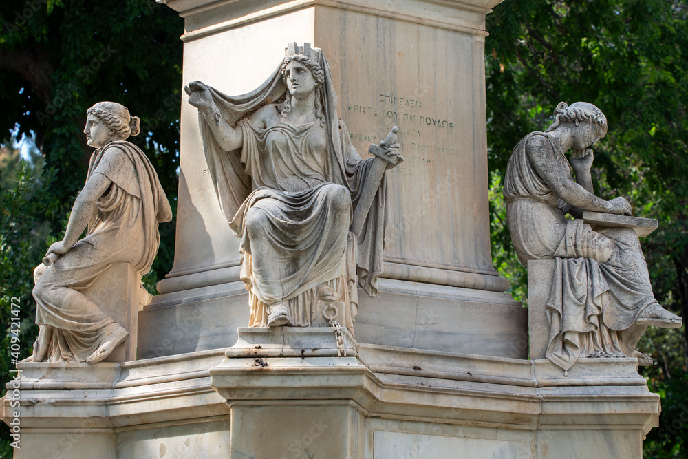 Marble statues on the base of the statue of Ioannis Varvakis in the ...