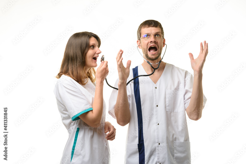 Girl doctor screams into the head of the phonendoscope worn by the ...