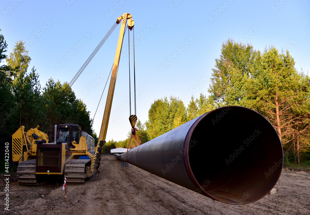 Natural gas pipeline construction work in forest area. Petrochemical ...