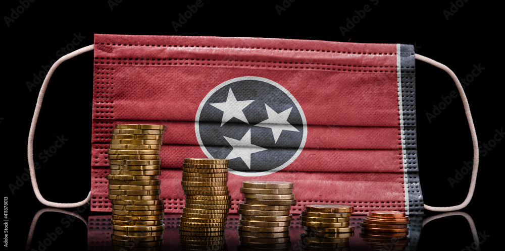 Medical mask with the flag of Tennessee behind some shrinking stacks of ...