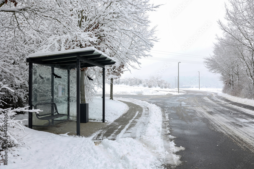 Bus stop by the snowy road in the countryside in winter Stock Photo ...