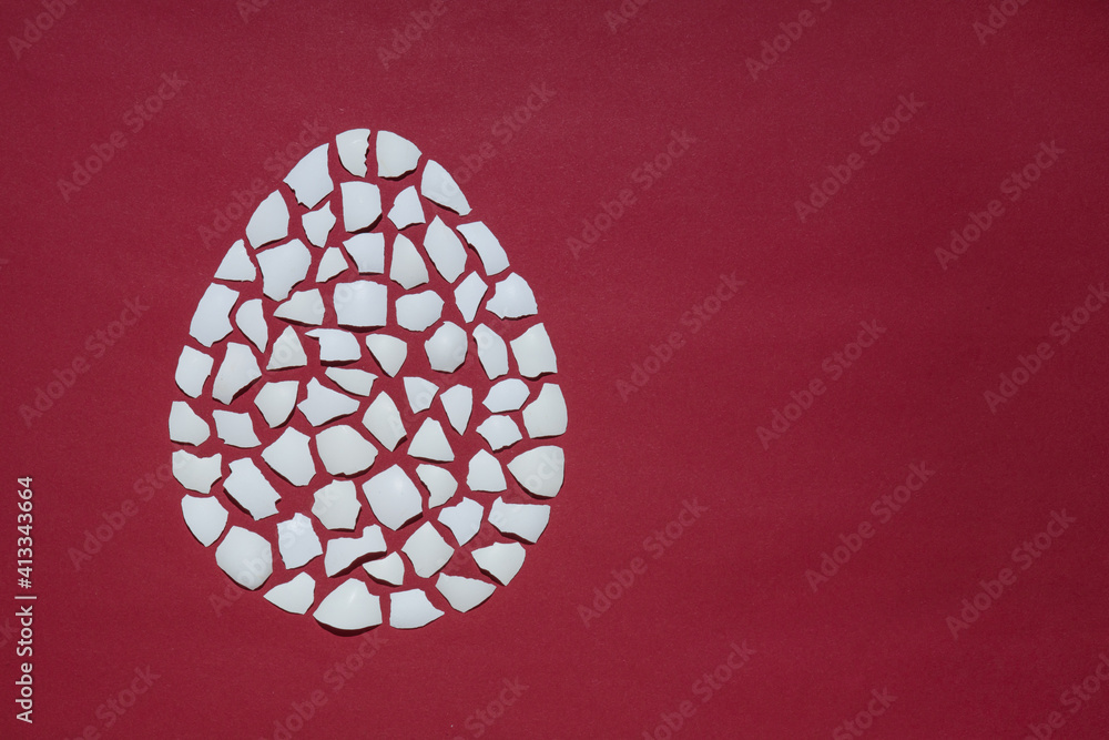 eggshell in the shape of an egg, mosaic on a red background, easter ...