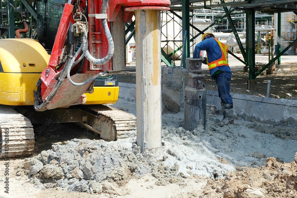 Hydraulic drilling machine is boring holes in the construction site for ...