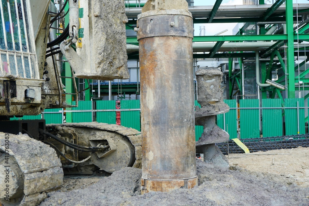 Hydraulic drilling machine is boring holes in the construction site for ...