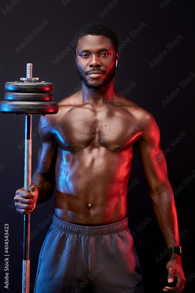 bodybuilder doing heavy weight exercise, using weight, pumping arm ...