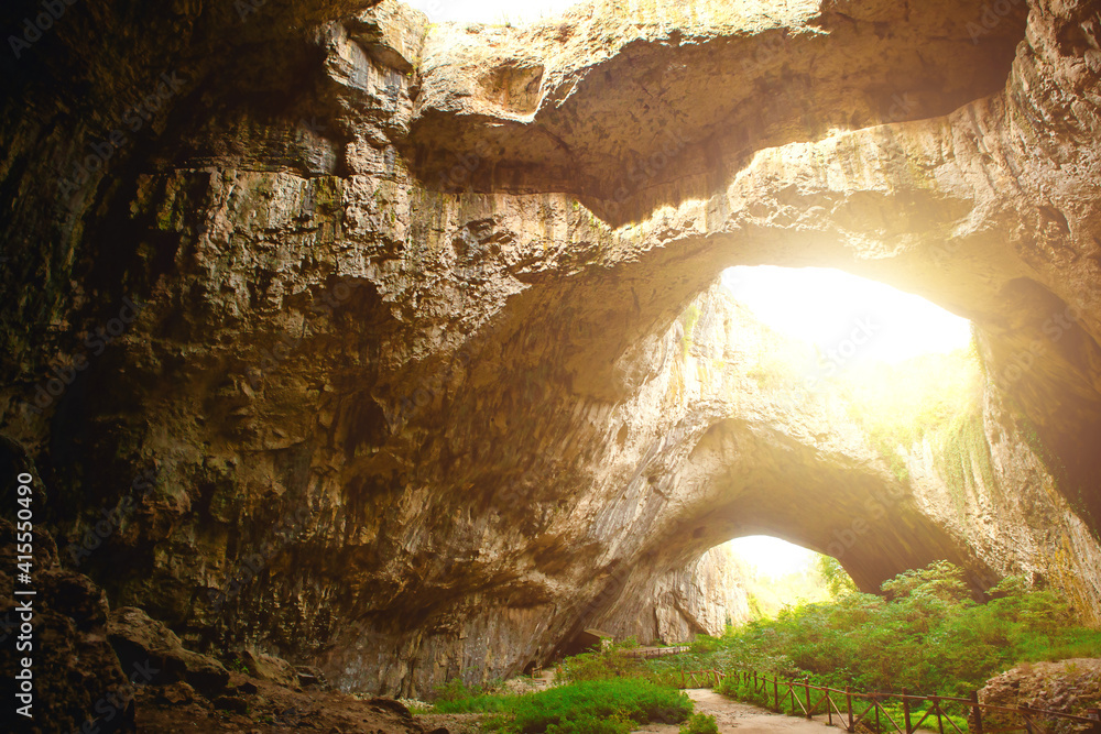 Devetashka cave in Bulgaria - natural attraction. High arches of a huge ...