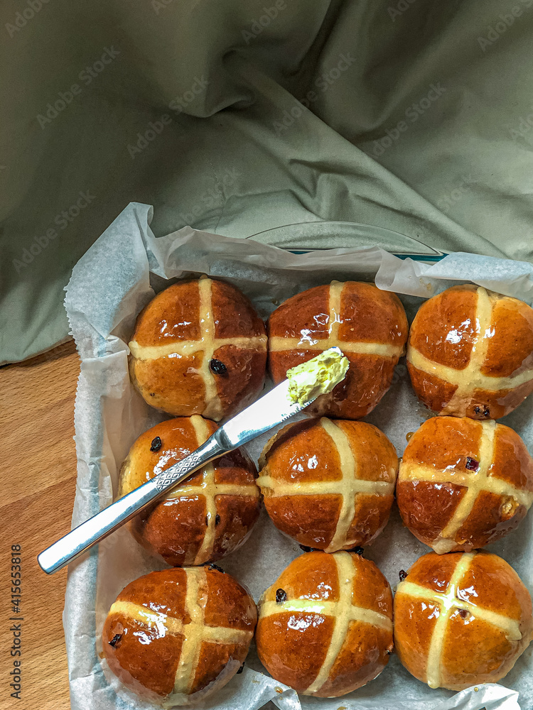Homemade Hot Cross Buns. A spiced sweet bun made with fruit, marked ...