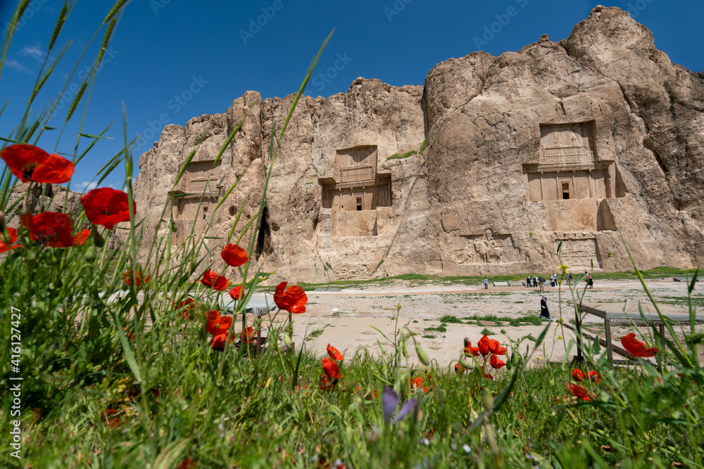 Sandstone rock with carved tombs of persian kings in Necropolis, Iran ...