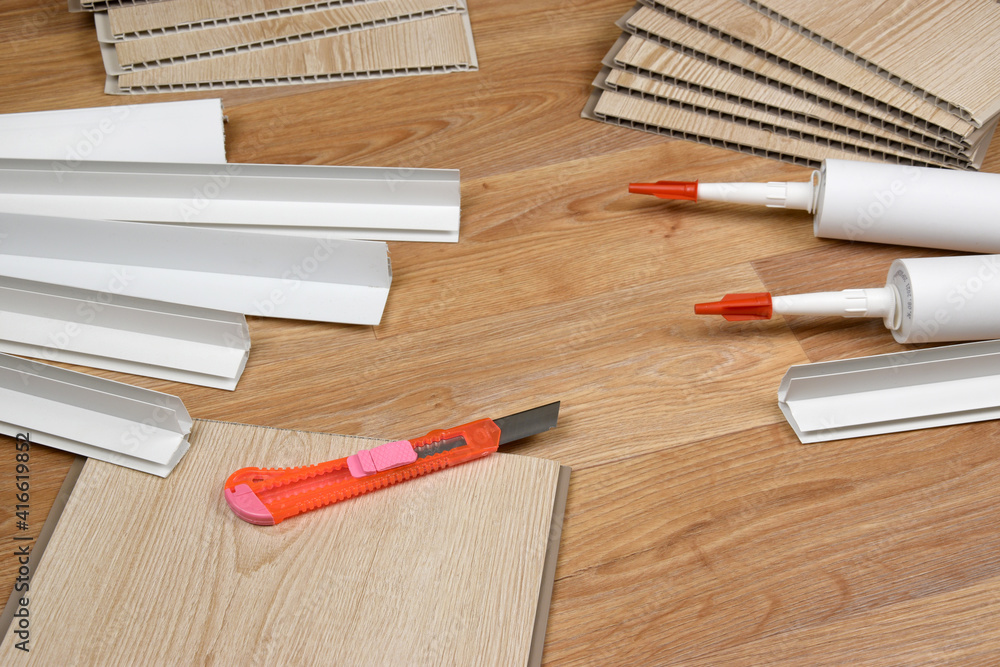 Set of items for PVC ceiling indoor works. Assembly adhesive bottles ...