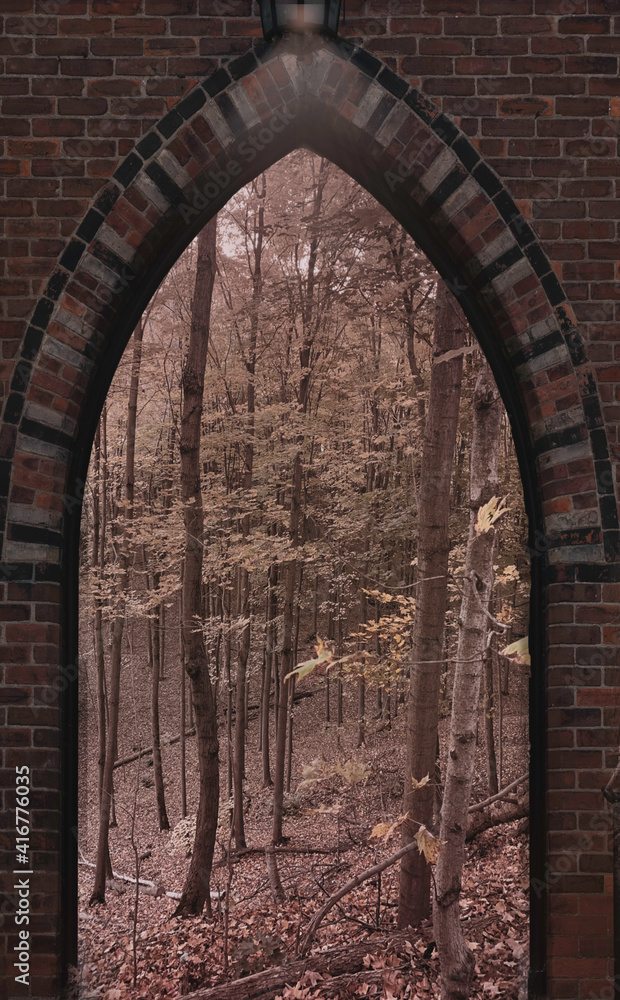 Old entrance gate made of bricks inviting to a fall background Stock ...