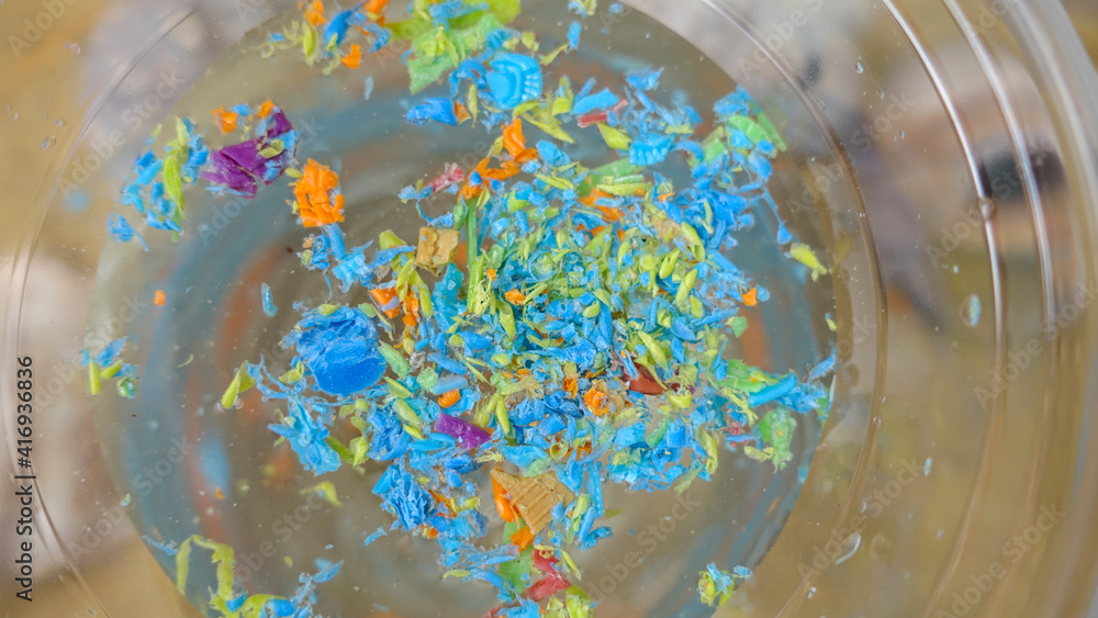 Stock-Foto „Microplastics in water in a single-use cup. Concept of ...