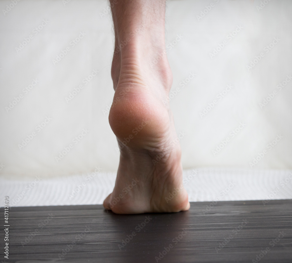 Foto de Stock Back of the foot, standing on tiptoe, detail | Adobe Stock