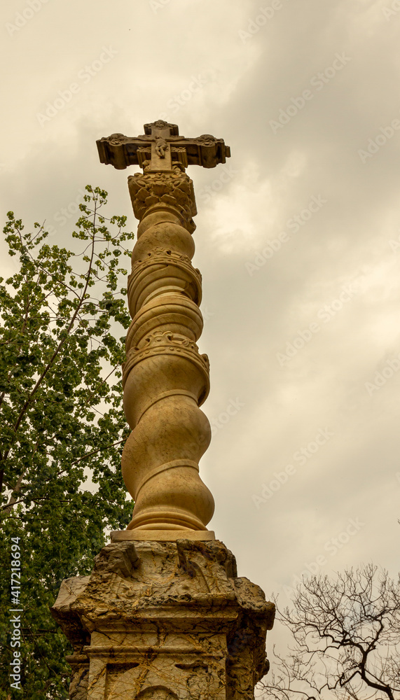Historic catholic cross, a monument spiraling to sky with Jesus on the ...