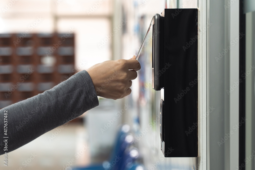 A hand using key card on scanner Stock Photo | Adobe Stock